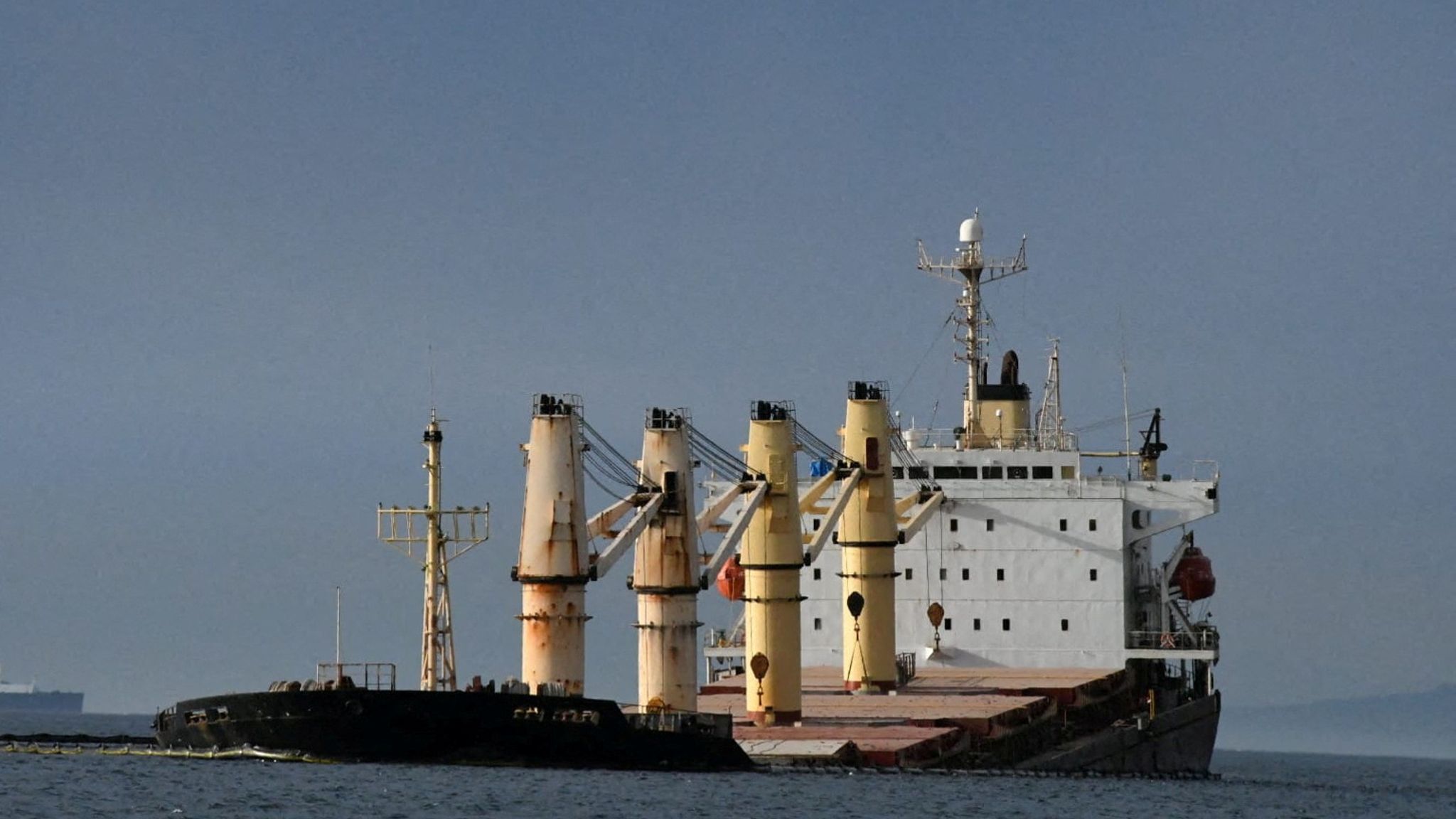 Gibraltar insists fuel leakage from stranded cargo ship is 'under ...