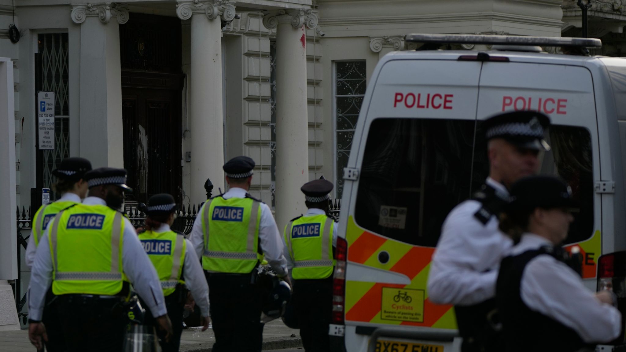 Protesters and police clash outside Iranian embassy in London amid ...