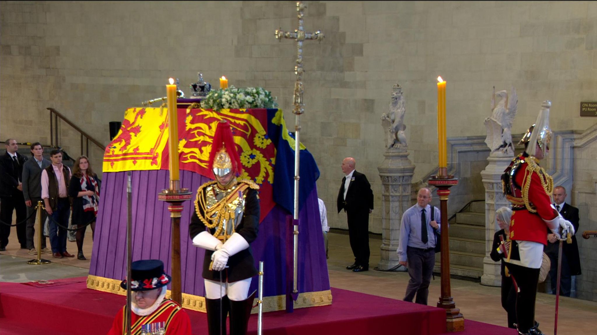 First mourners walk past Queen's coffin as monarch lies in state at ...