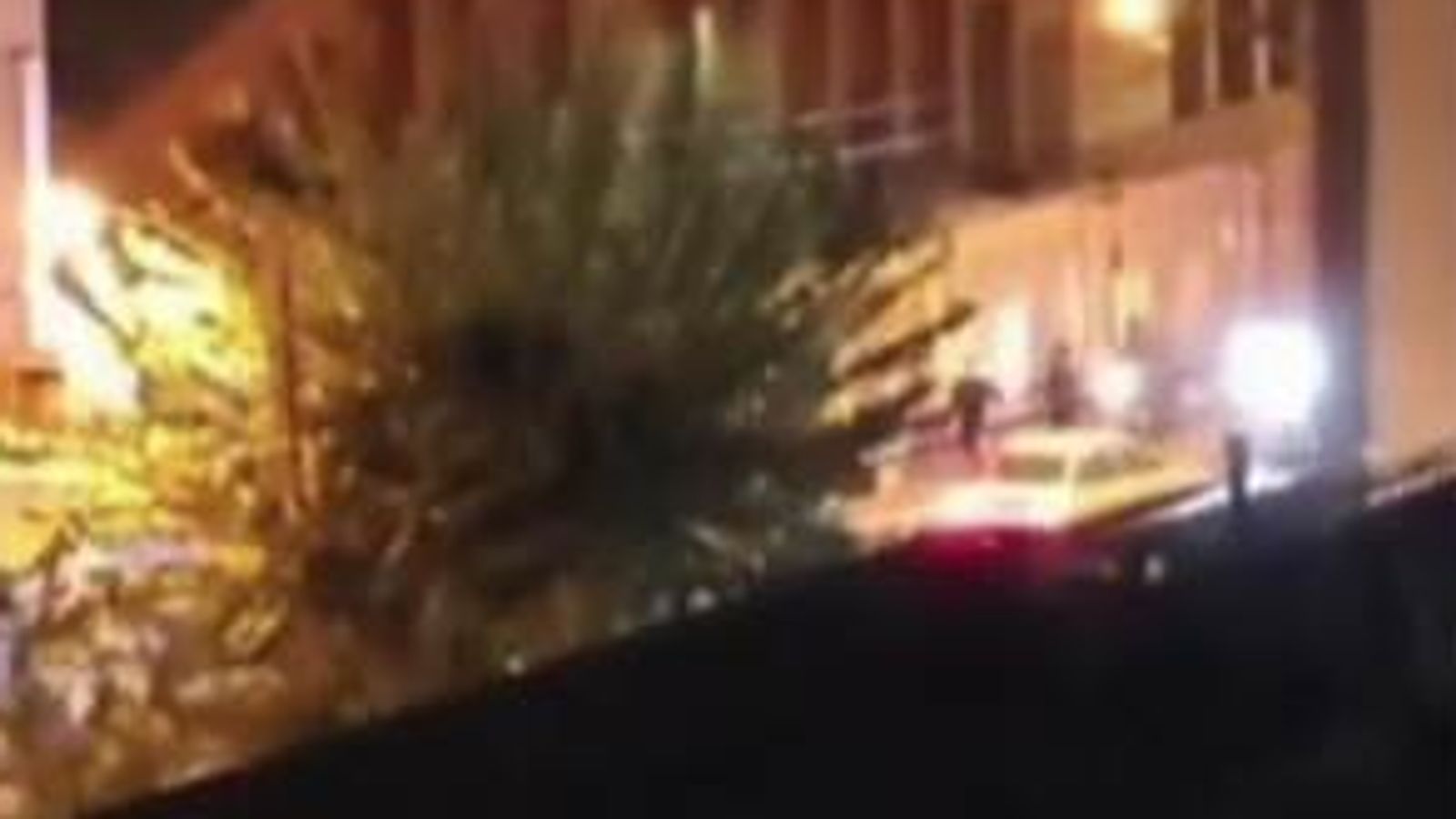 Iran: People seen running down street as gunfire rings out near Sharif ...