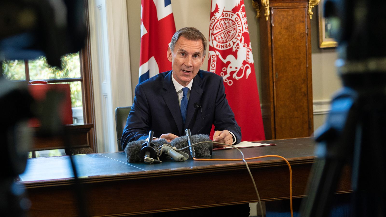 UK economy: Income tax cut to be delayed 'indefinitely', says ...