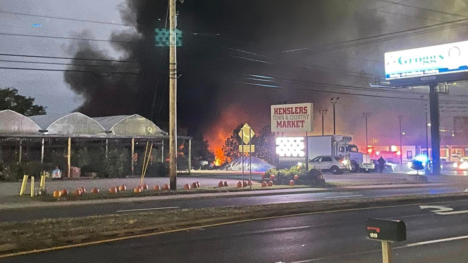 Two Killed After Small Plane Crashes Into Car Park Of Car Dealership In