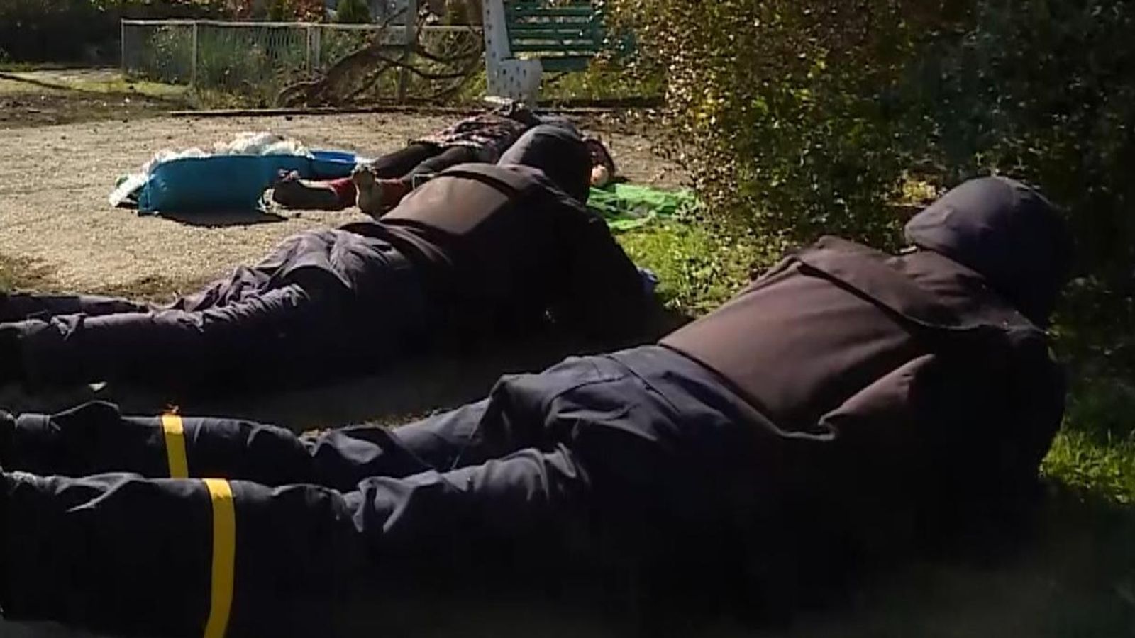 Ambulance teams in Ukraine try to assist wounded people surrounded by ...