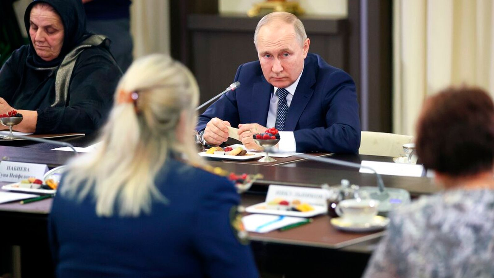 Vladimir Putin looks 'pained' as he has tea with mothers of Russian ...