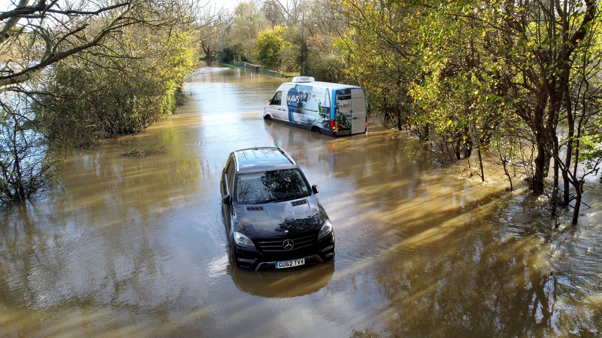 UK weather: Roads and railway tracks hit by flooding as month's worth ...