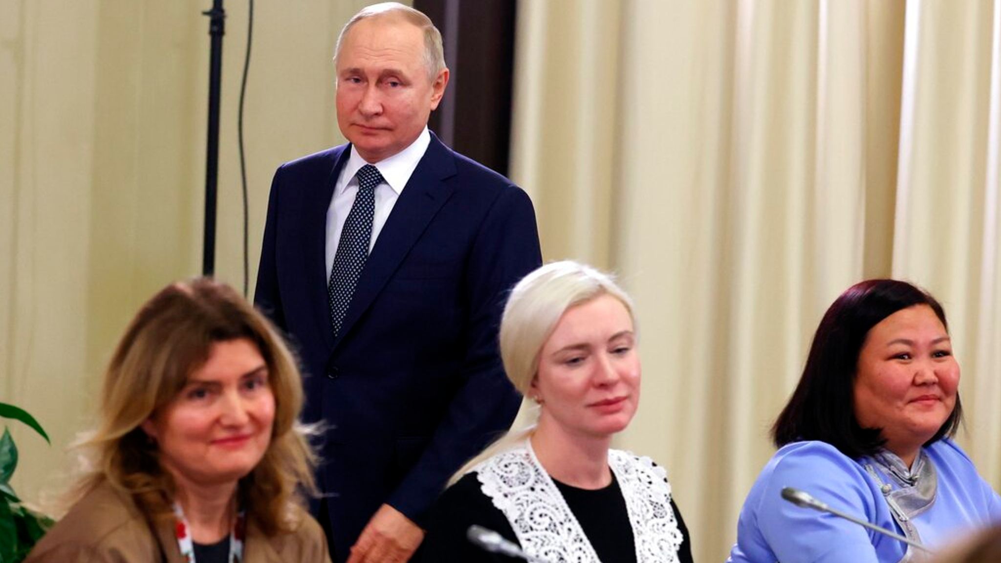 Vladimir Putin looks 'pained' as he has tea with mothers of Russian ...