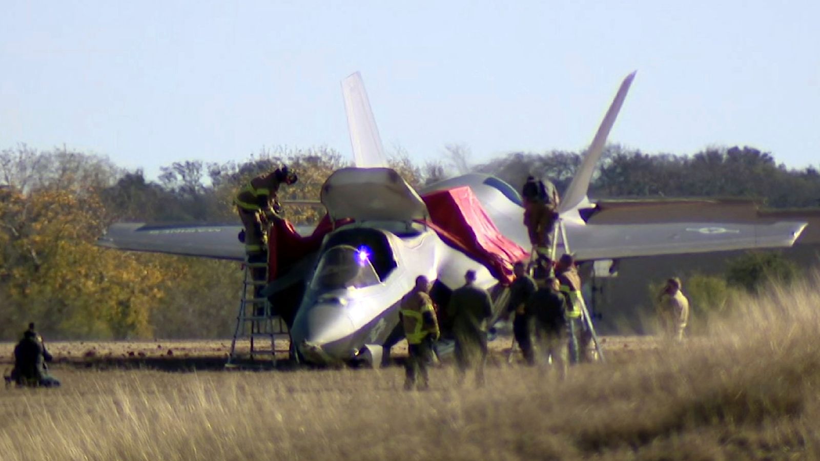 Failed landing sees pilot eject as military jet nosedives on to runway ...