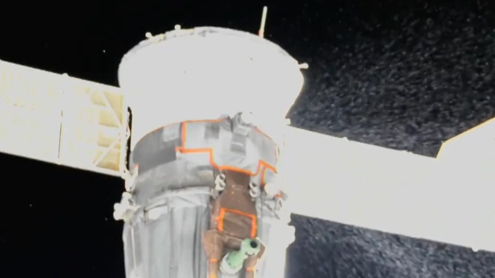 'Particles' seen leaking from Russian space capsule docked at ISS ...