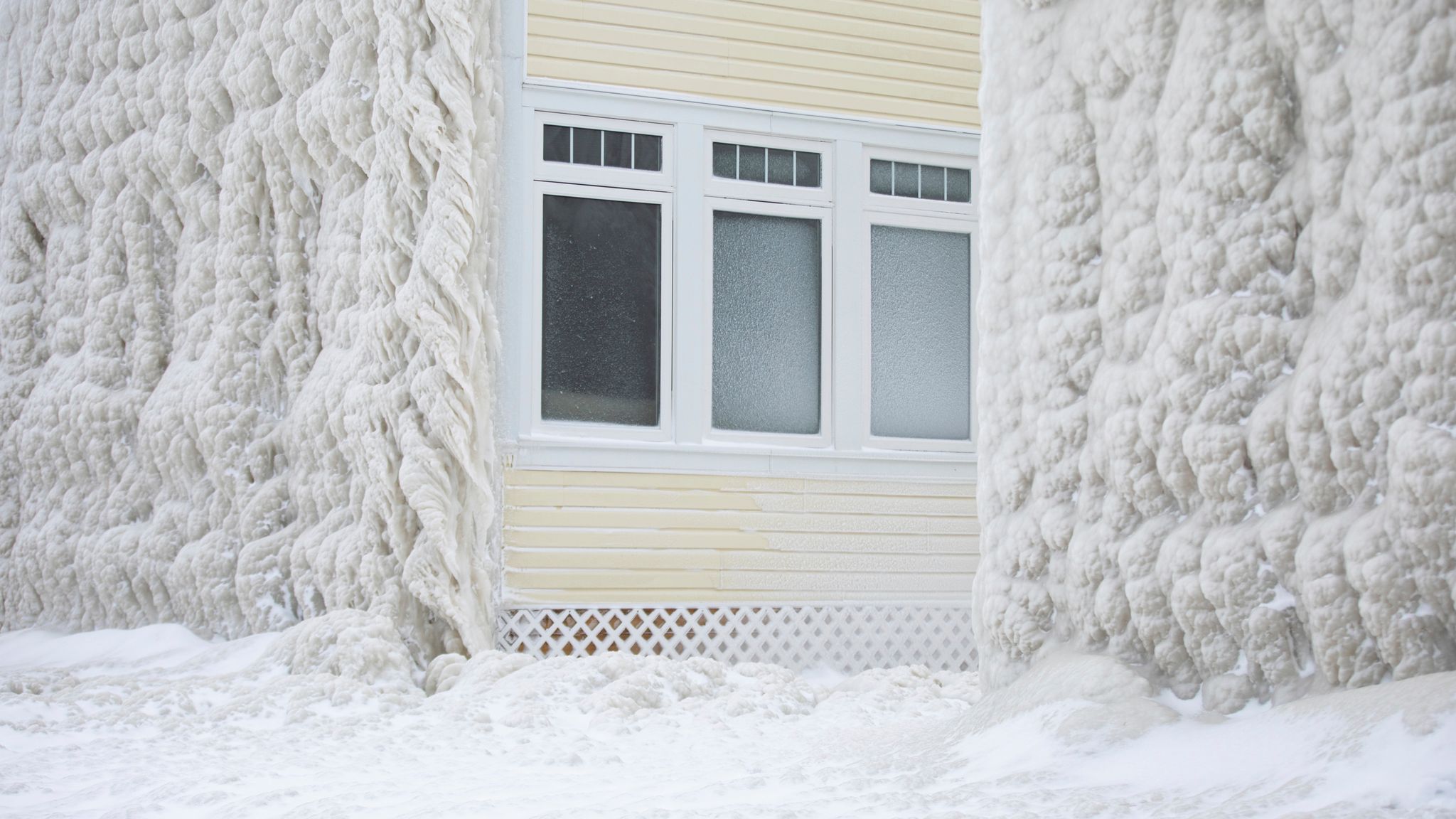 US snow storm covers houses in ice as people struggle to dig out after ...