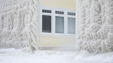 US snow storm covers houses in ice as people struggle to dig out after ...