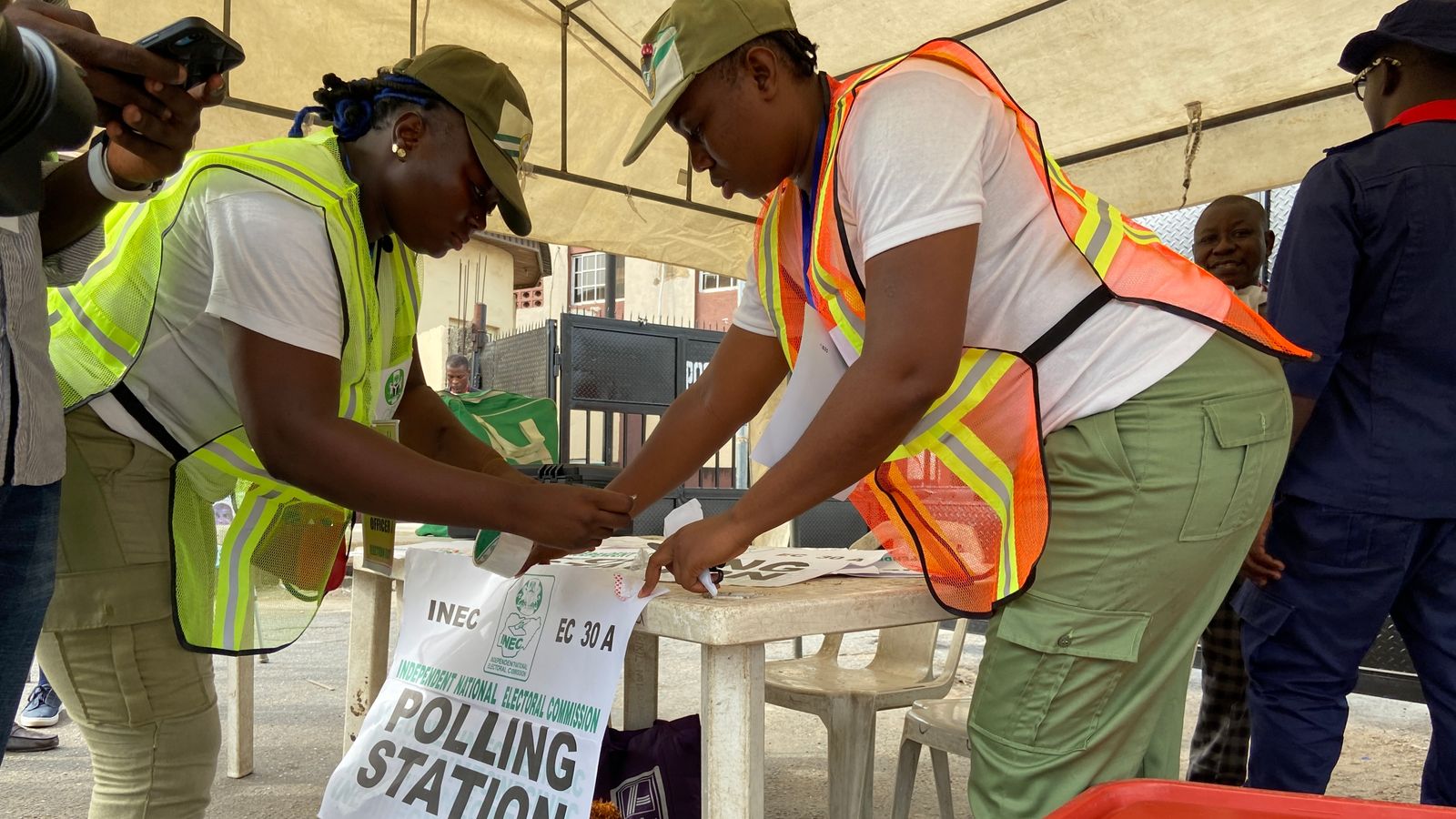 Nigeria election: Crowds chant 'let us vote' after unexplained delays at polling units as they ...