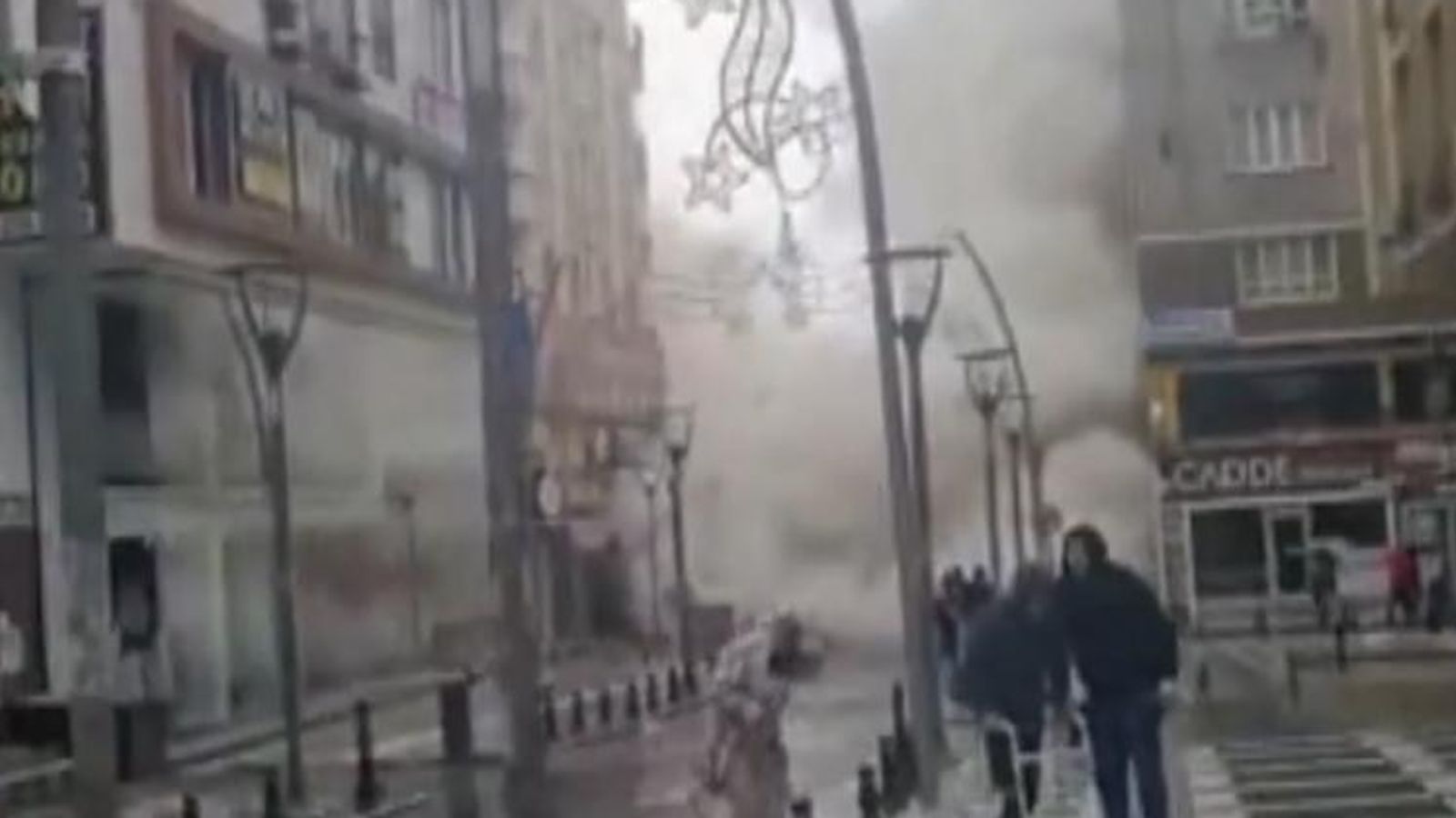 Turkey earthquake: People run for cover as building collapses onto ...