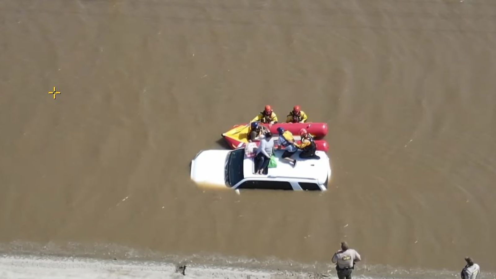 California: Three people and a dog rescued from flooded car after ...