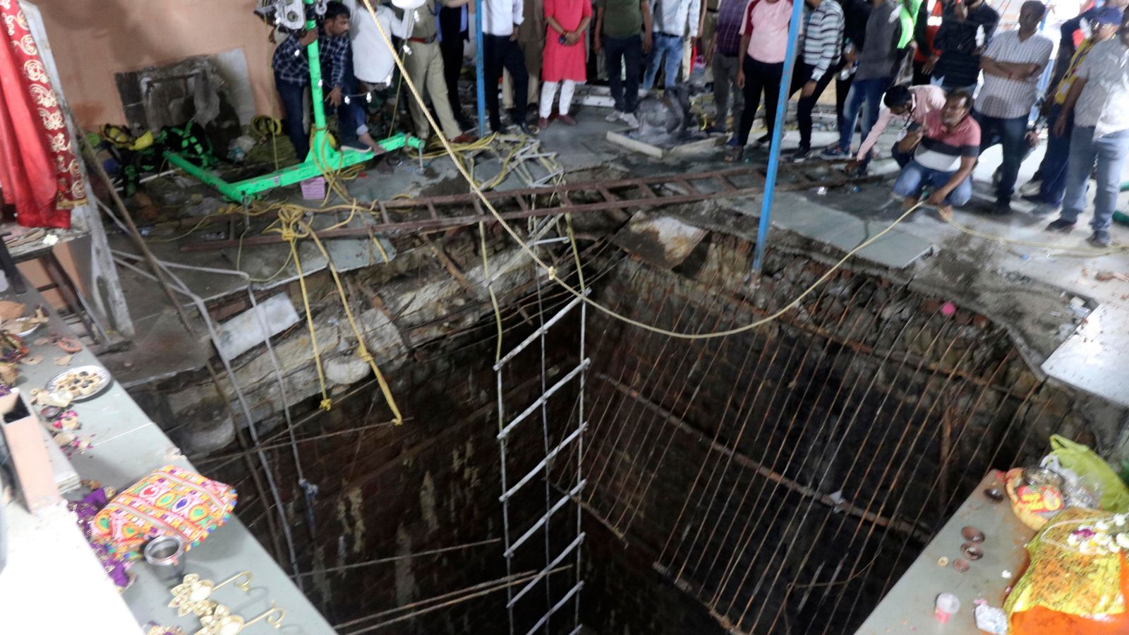 At least 35 people killed after falling into well during celebration at ...