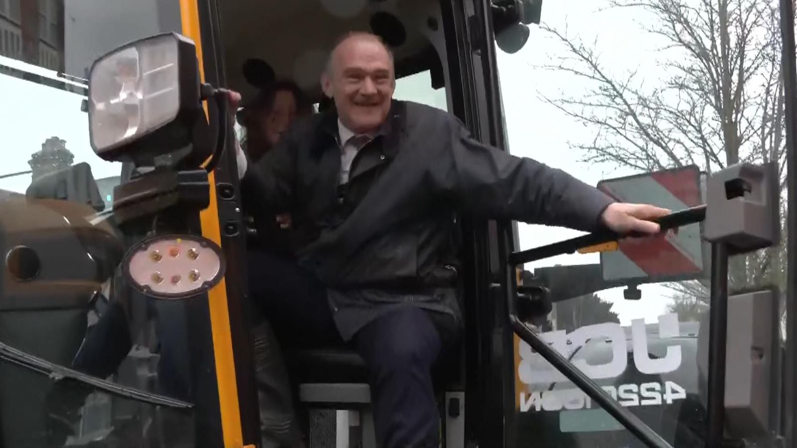 Lib Dem leader Sir Ed Davey arrives in a tractor to meet party ...
