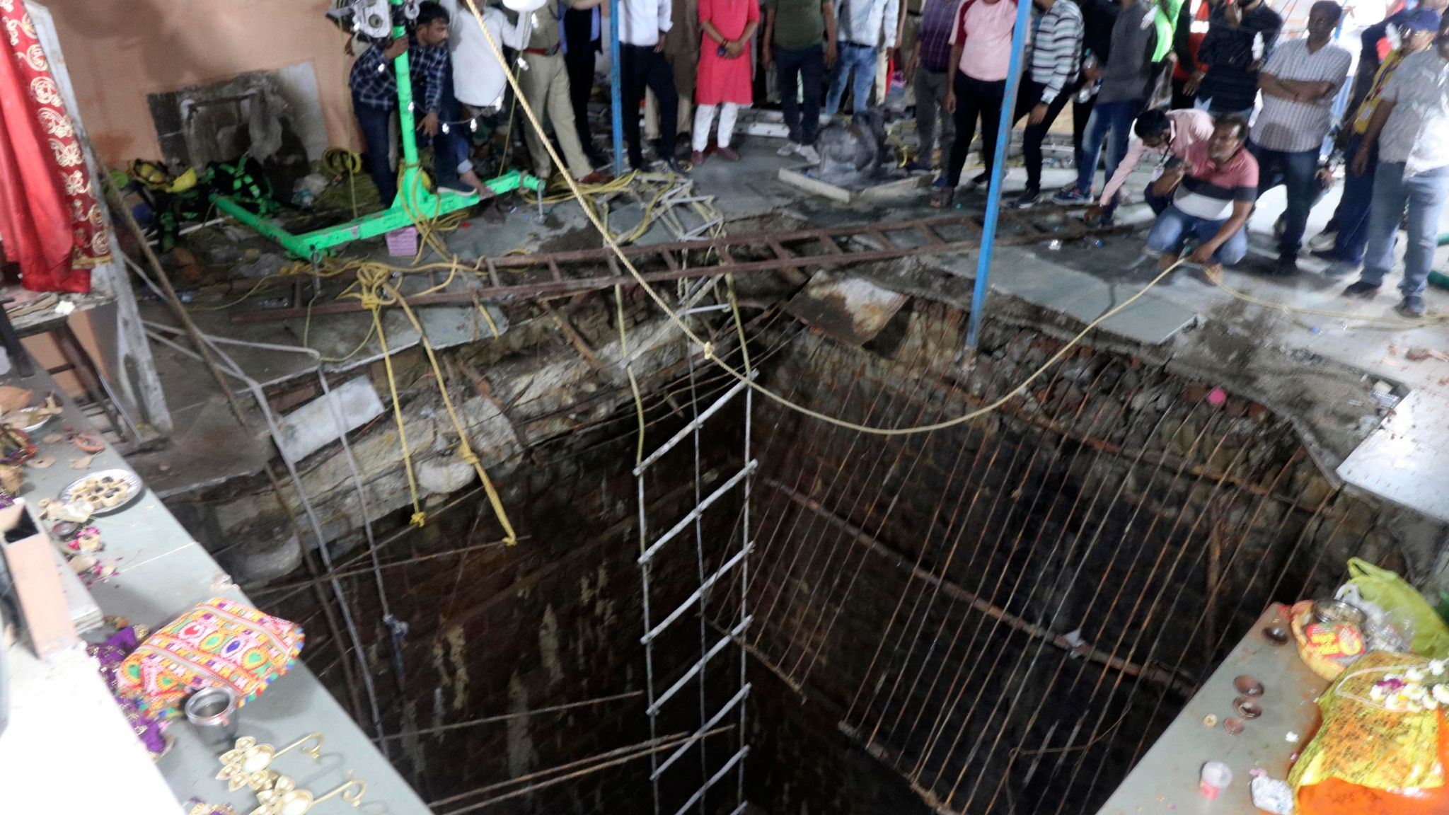 At least 35 people killed after falling into well during celebration at ...