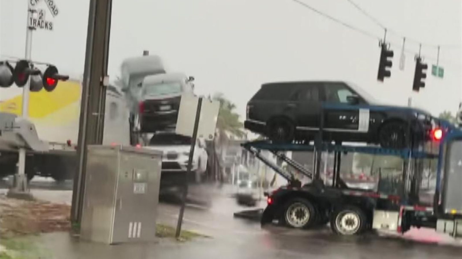 Train crashes into car transporter stuck on a railway crossing | US ...
