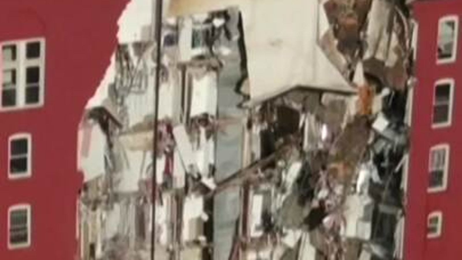 Search and rescue efforts ongoing after apartment building partially ...