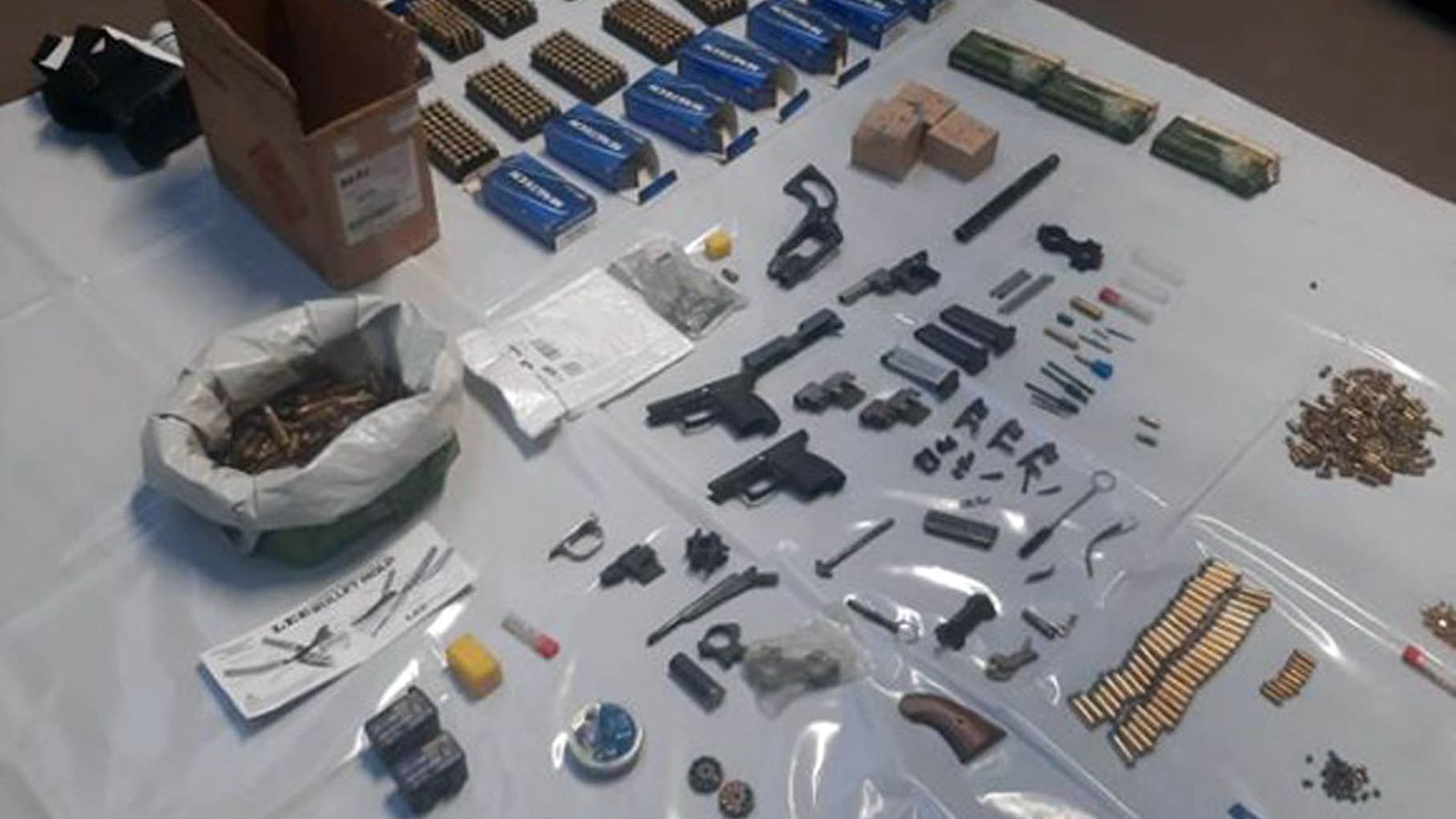 Converted weapons and live ammunition found in gun factory raid in ...
