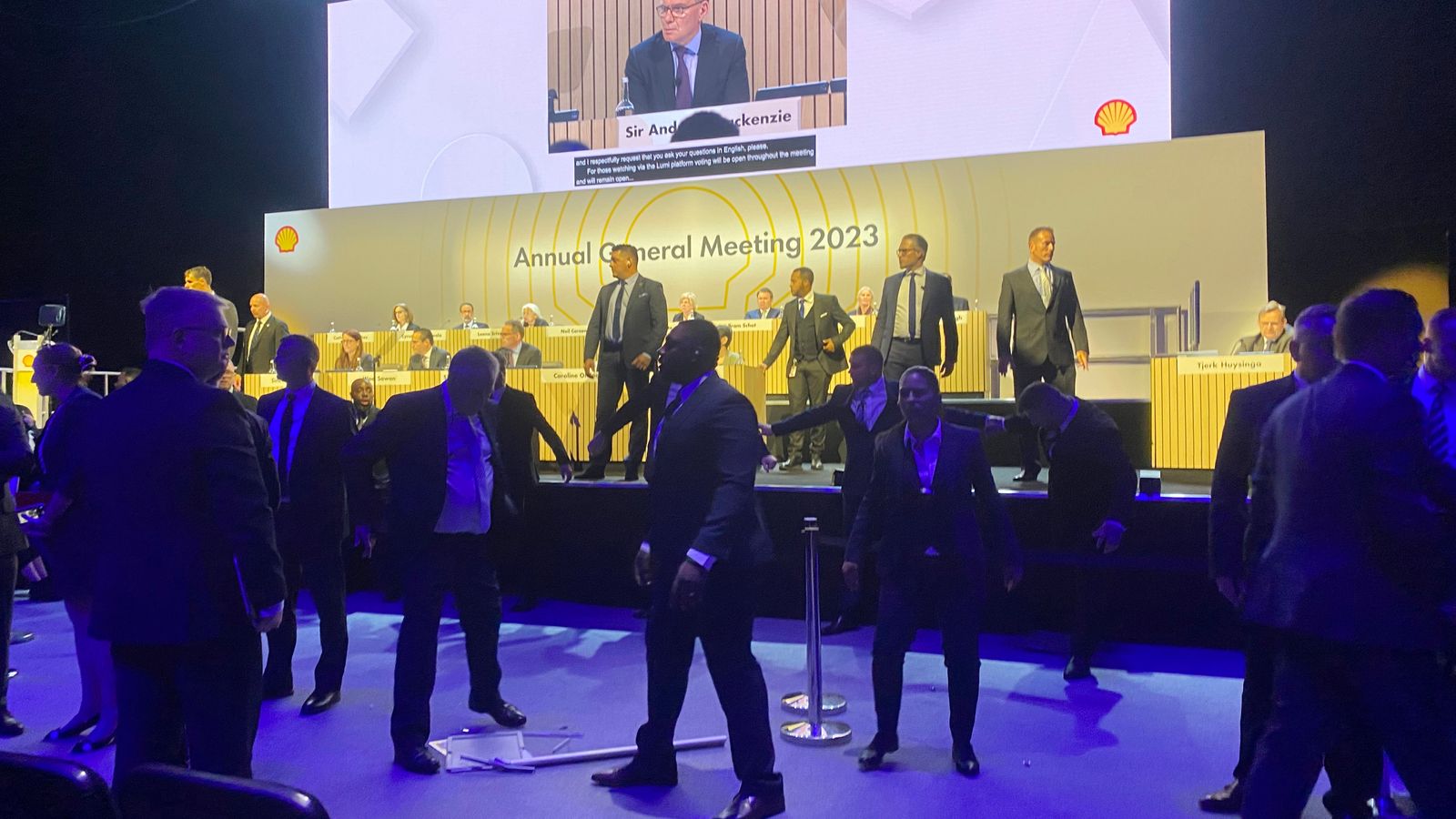 Climate change protesters try to storm stage at Shell AGM | Sky News