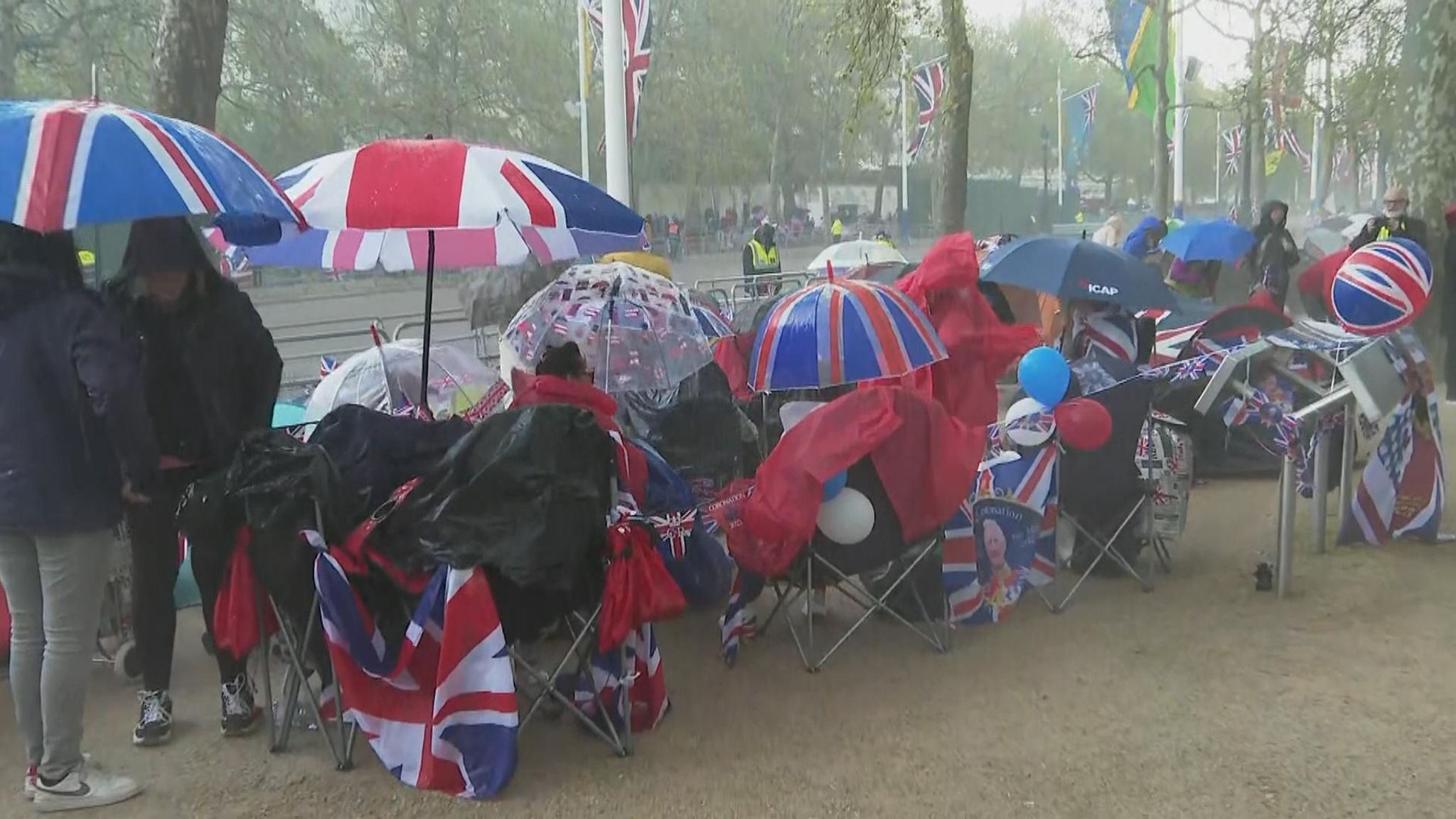 Coronation weather: Flypast could be cancelled due to rain - as royal fans get caught in London ...