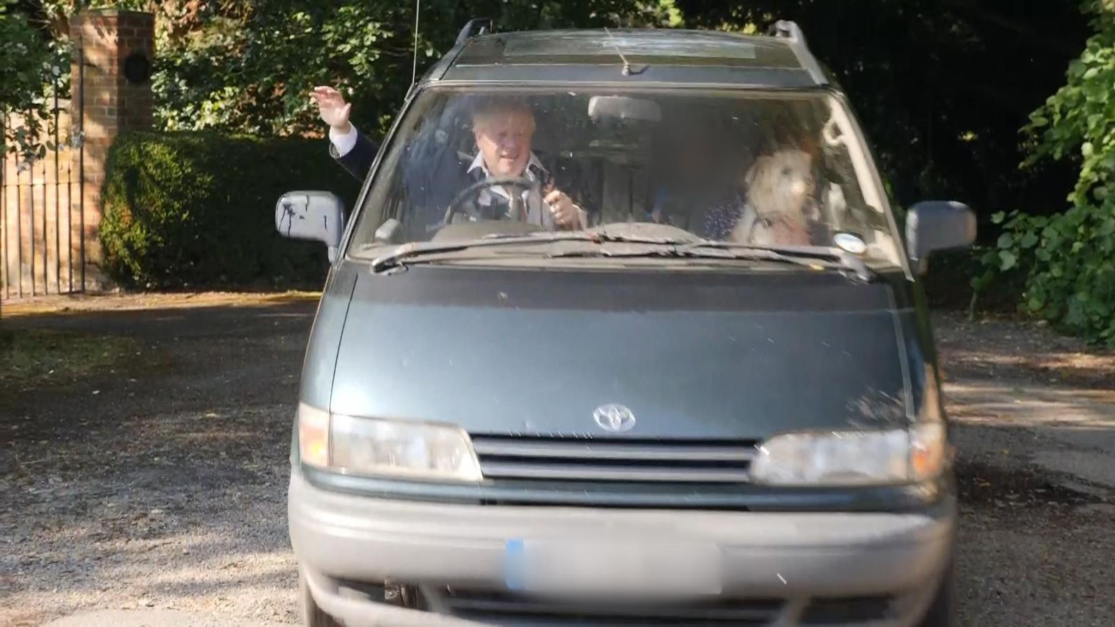 Former prime minister Boris Johnson waves at reporters after resigning ...