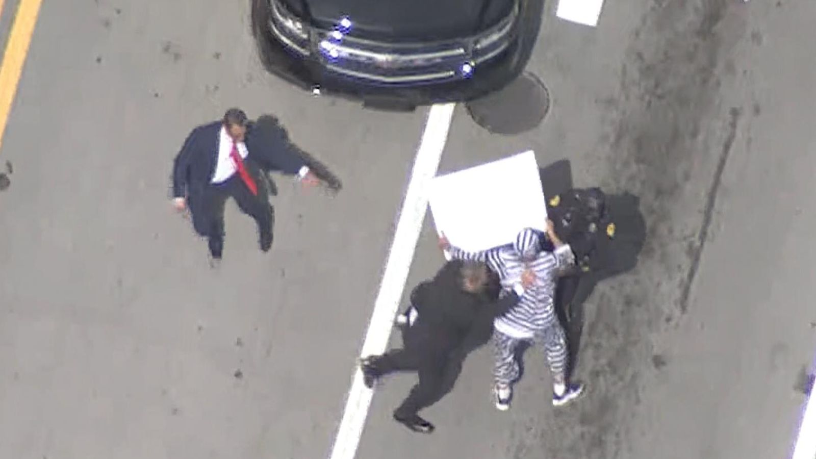 Donald Trump: Moment protester runs in front of convoy as ex-president ...