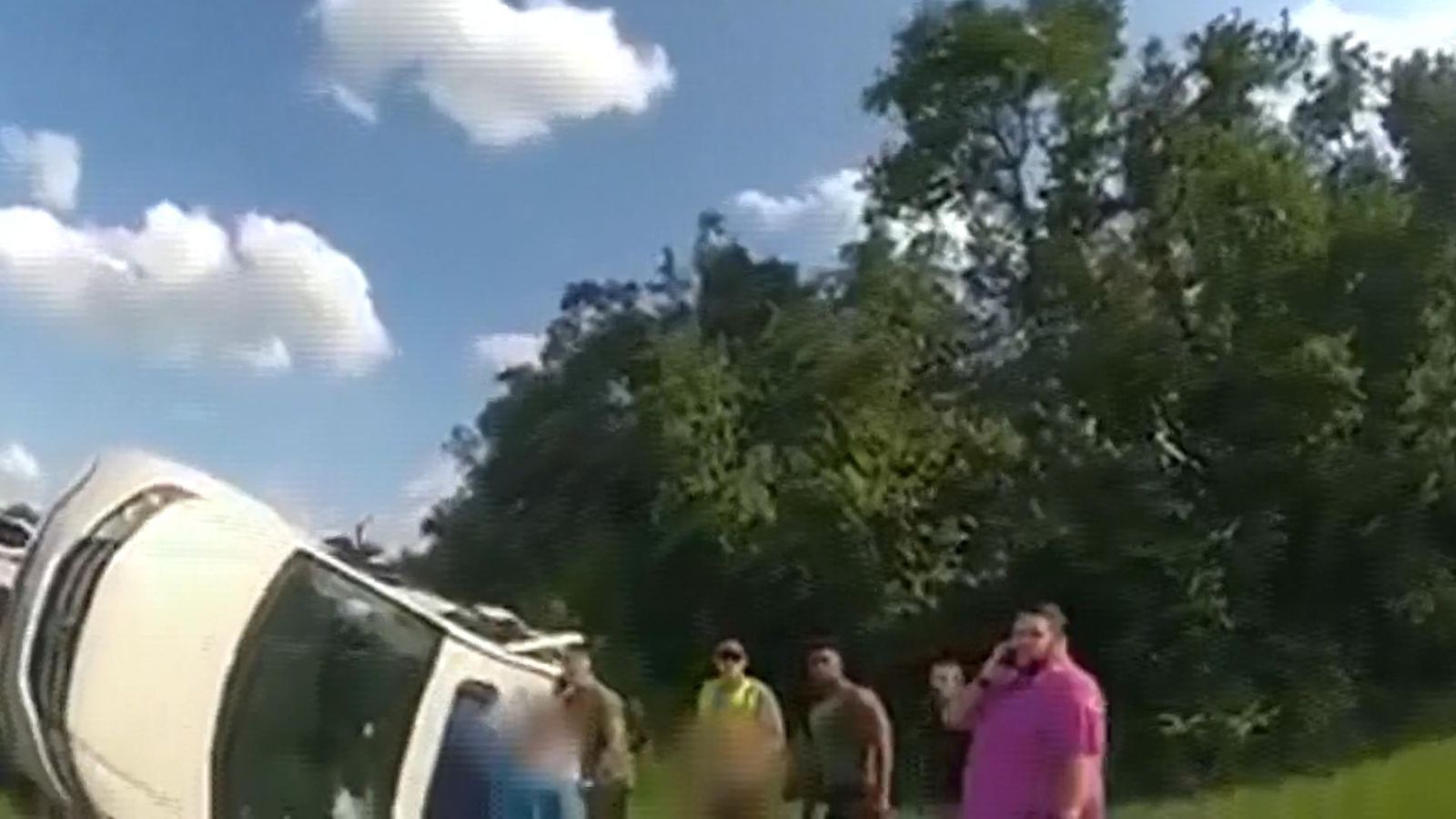 Florida: Police bodycam shows family rescued after minivan rollover accident | World News | Sky News