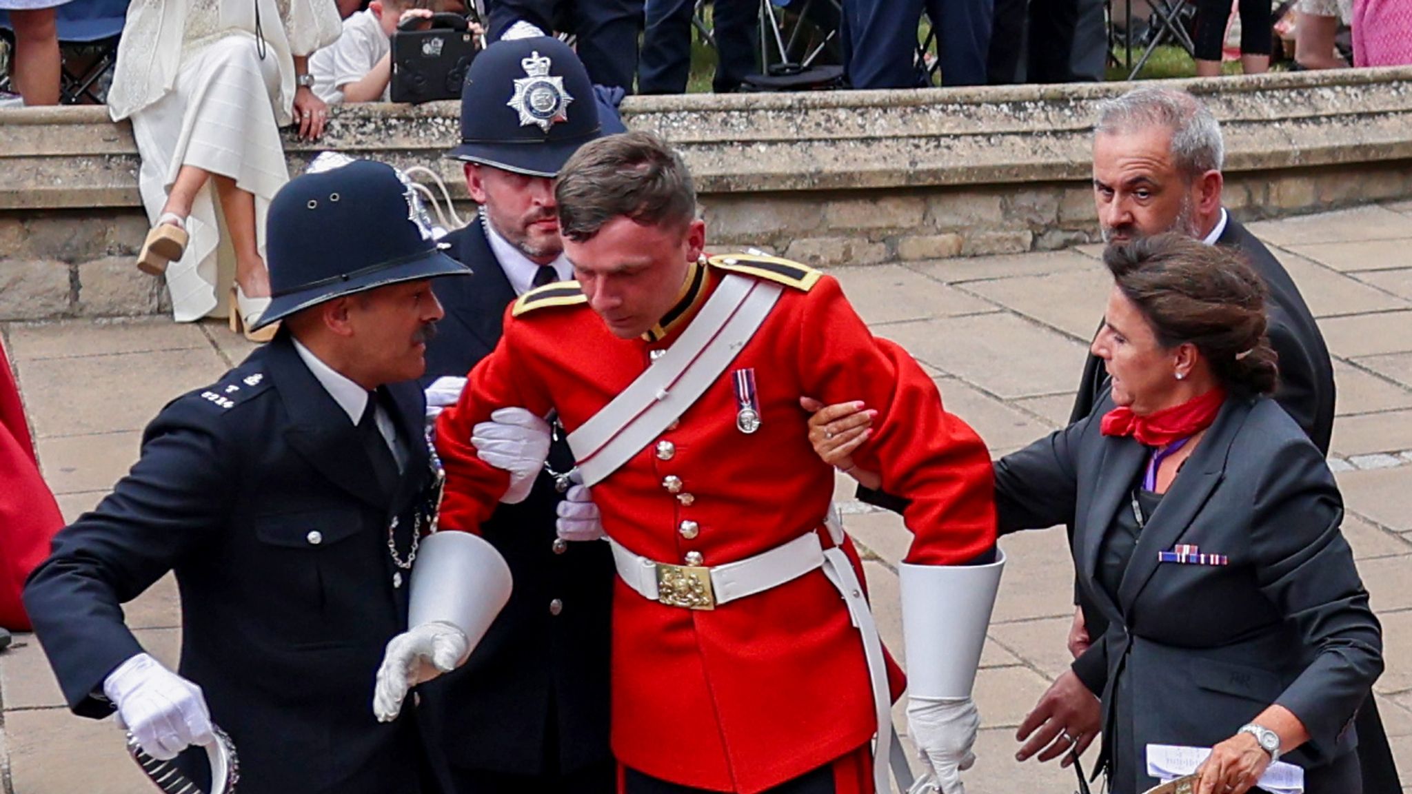 Soldier helped by police after fainting at King's first Order of the ...