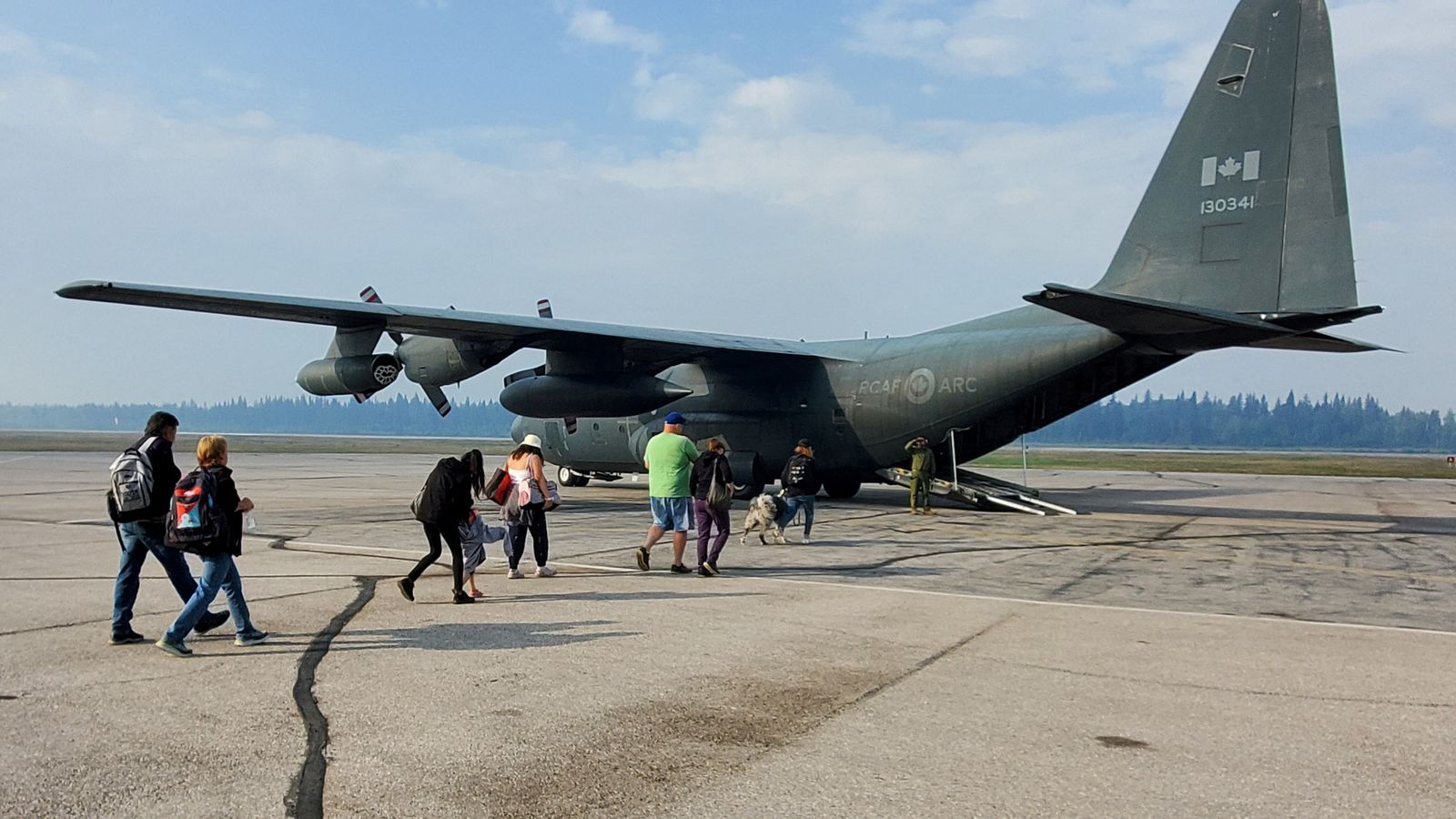 Canada wildfires: Thousands urged to evacuate by road and air as blaze ...