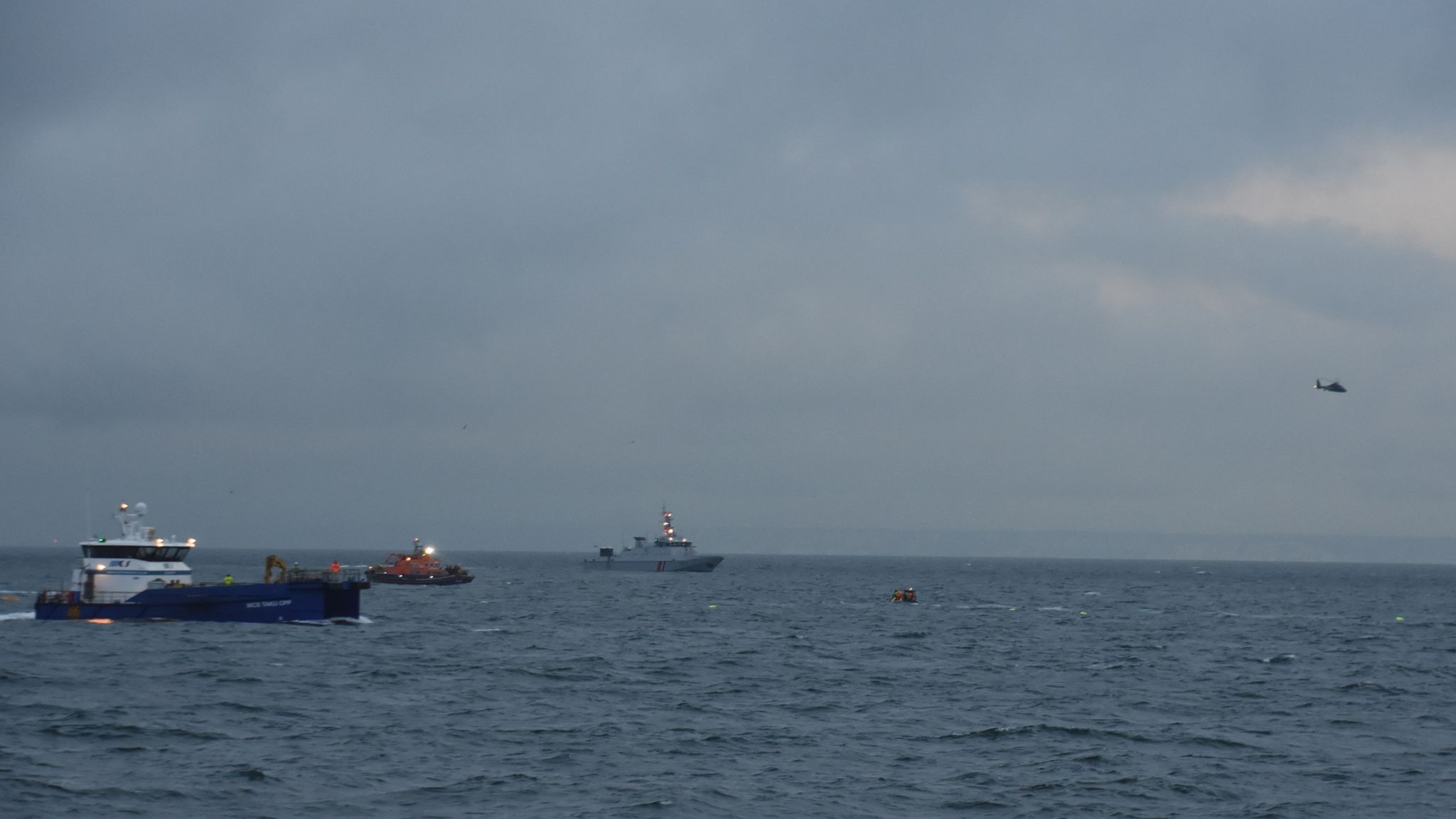 At least six people dead and dozens rescued as migrant boat crossing ...