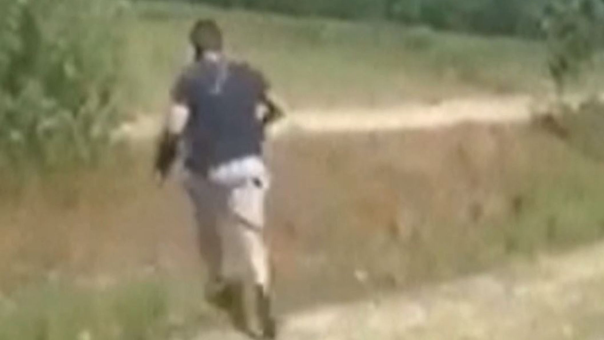 Footage shows moment suspected human trafficker jumps out of car during ...