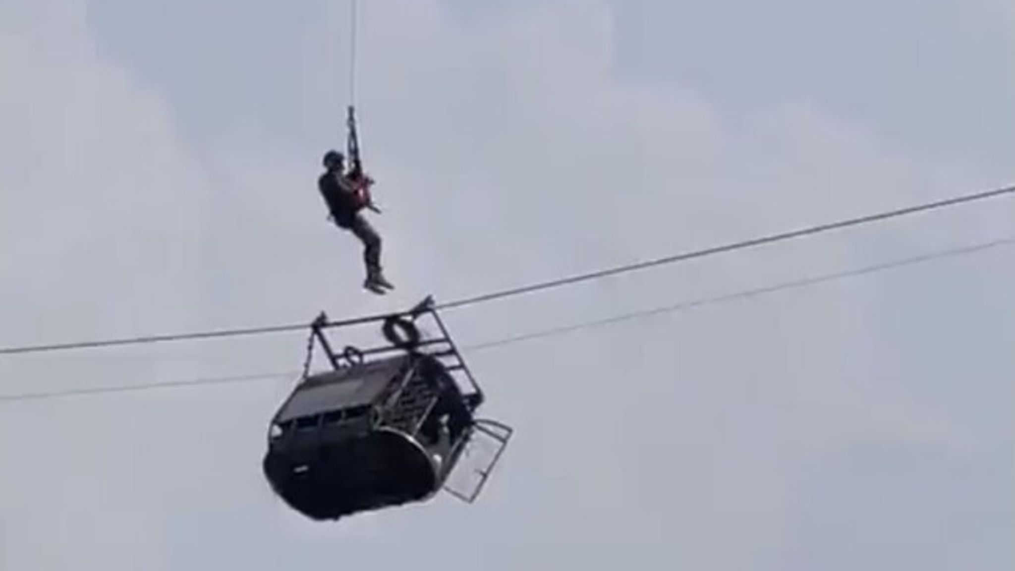 Pakistan: All eight people rescued from broken cable car dangling 274m ...