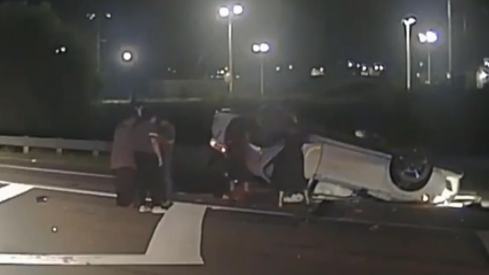 US: Officers lift flipped car to save trapped driver | News UK Video ...