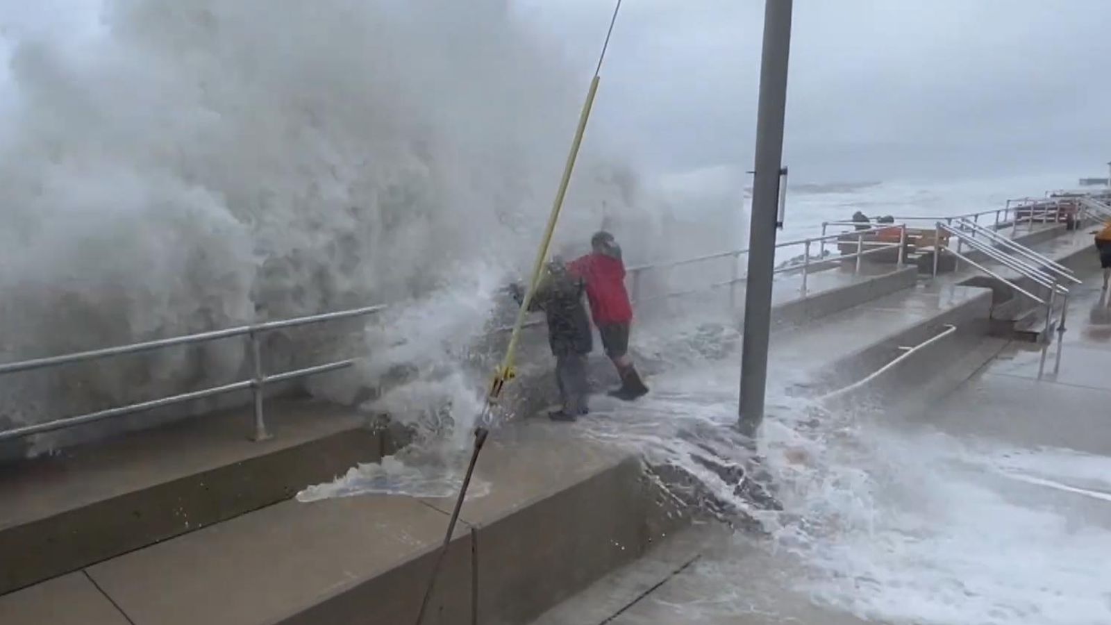 New Jersey: People hang on as storm surge waves crash into them during ...