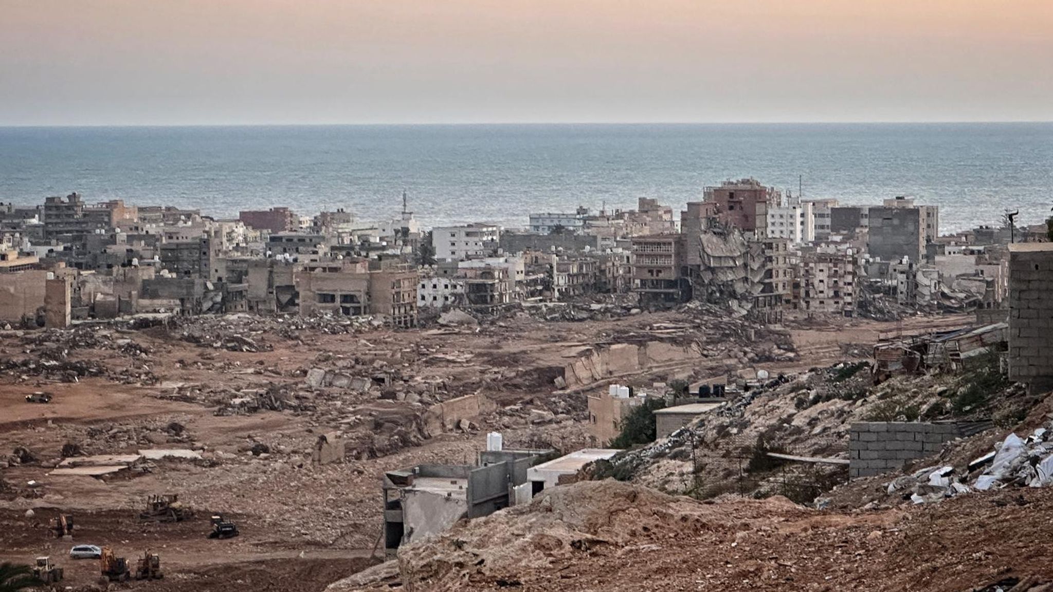 Libya floods: Collapsed bridges and wrecked homes seen in before and ...