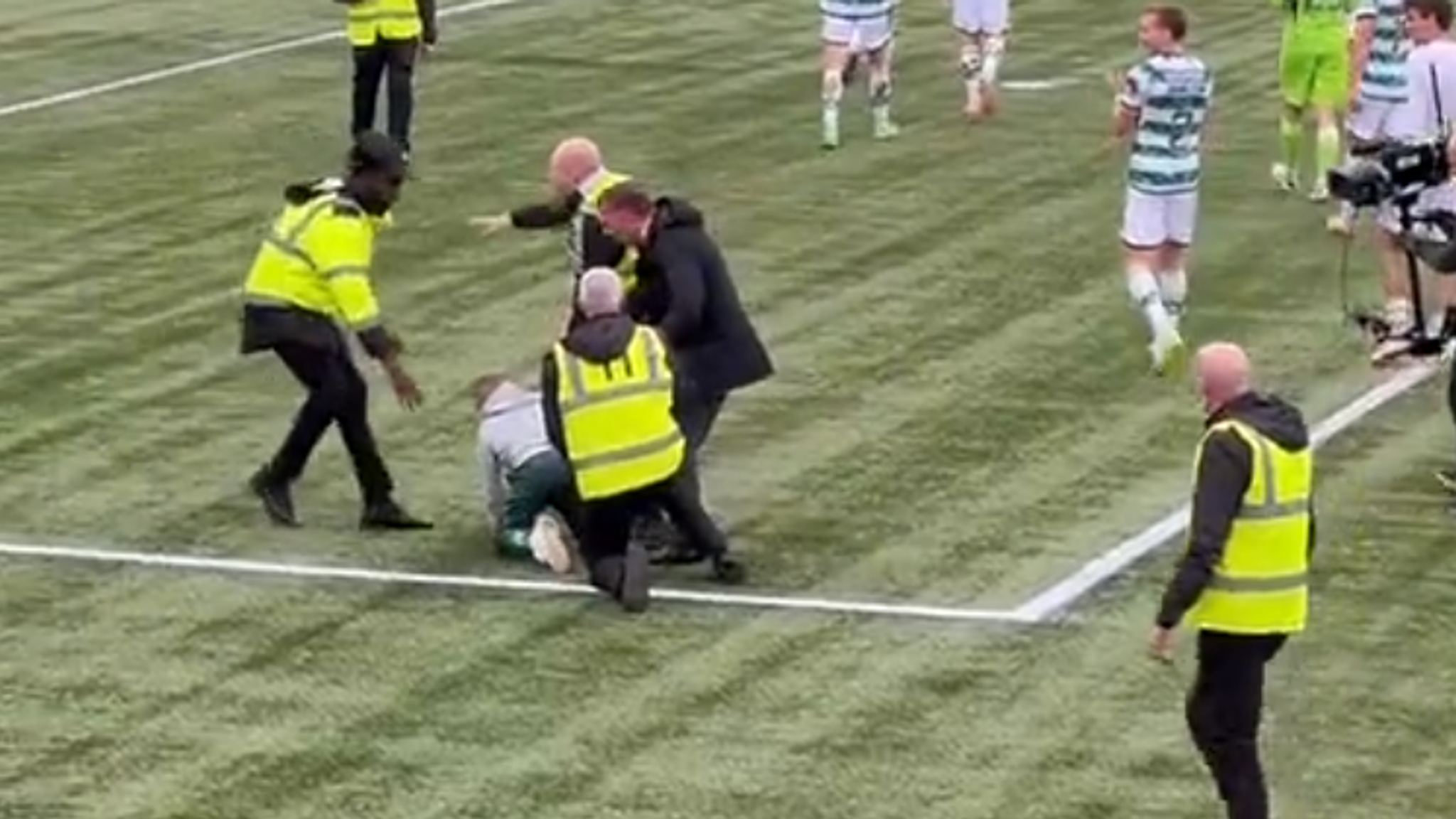 Brendan Rodgers pushes back steward after he knocked Celtic fan to the ...