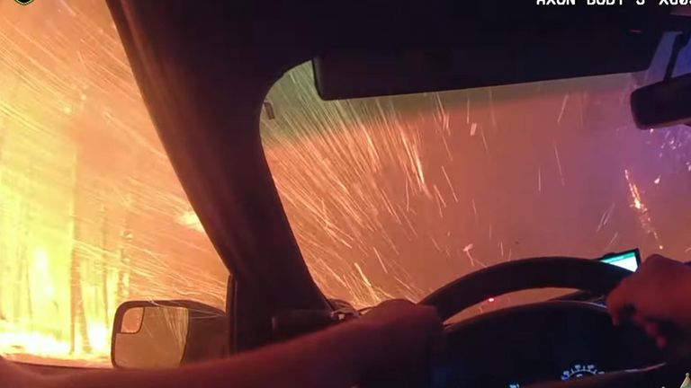 Bodycam footage shows dramatic wildfire escape | US News | Sky News Bodycam footage shows dramatic wildfire escape | US News | Sky News