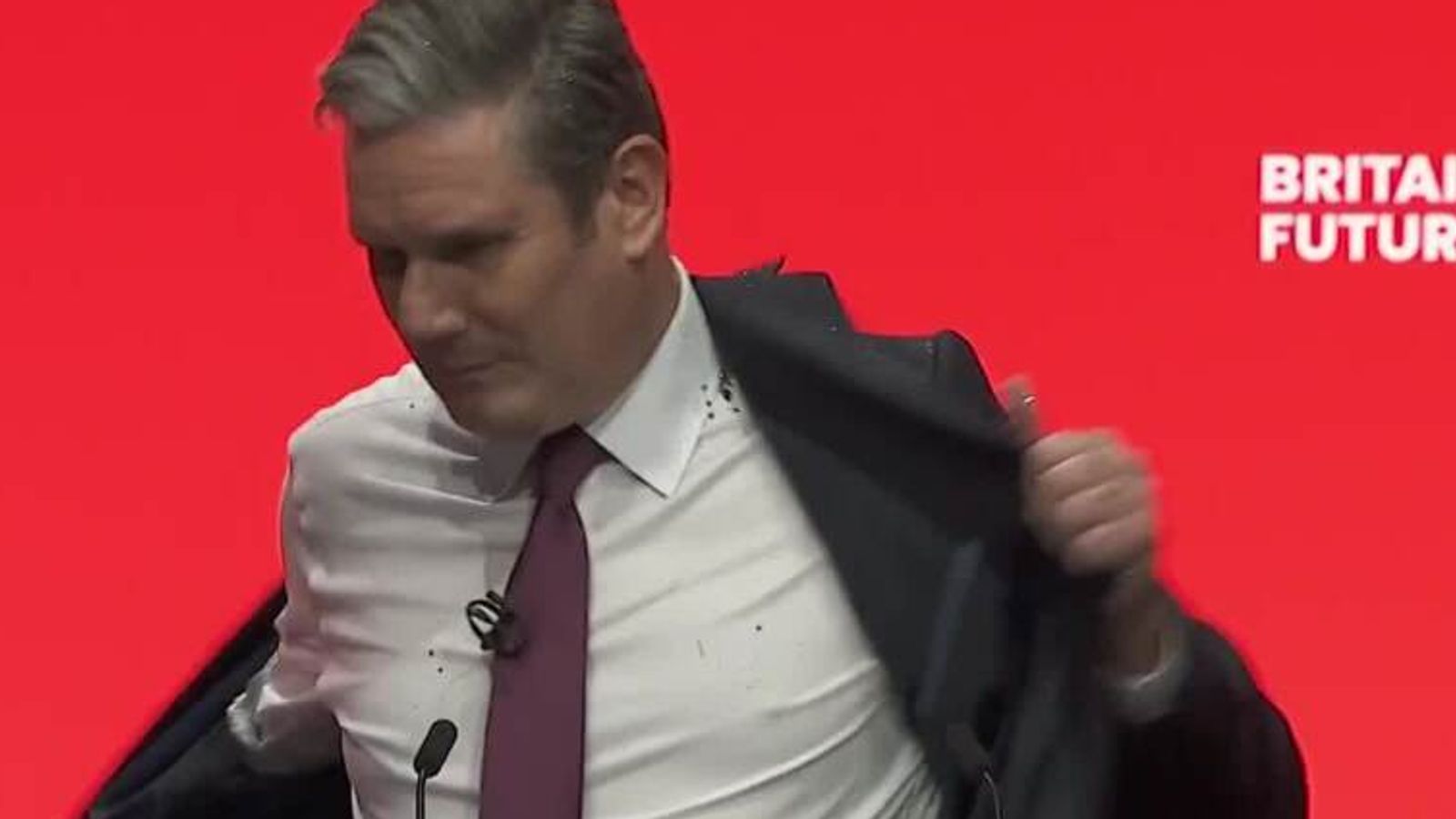 Protester throws glitter over Sir Keir Starmer during speech at Labour ... Protester throws glitter over Sir Keir Starmer during speech at Labour ...