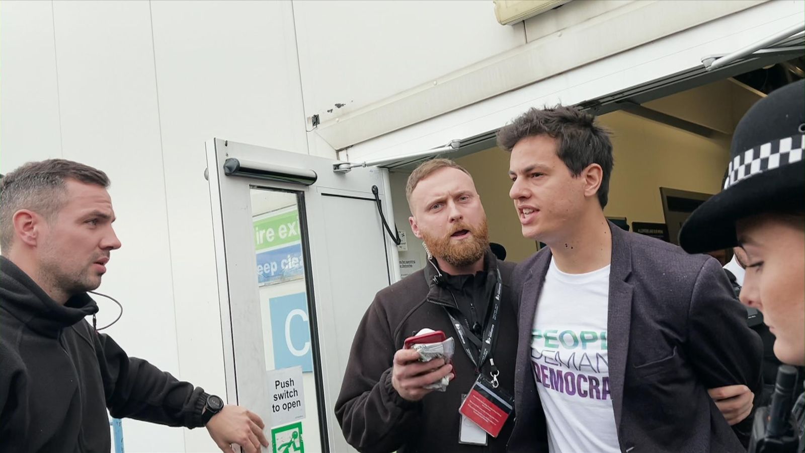 Labour: Protester taken into police van after covering Sir Keir Starmer ...