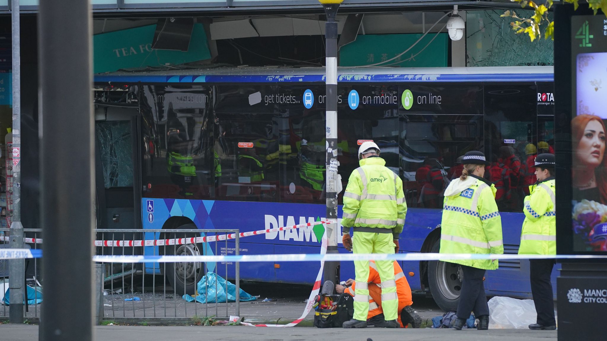 Manchester crash: Driver arrested after bus smashes into city centre ...