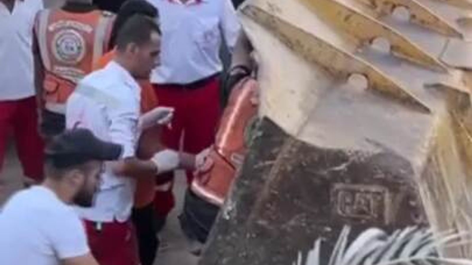 Gaza: Bulldozer carries woman to ambulance after Israeli airstrike ...