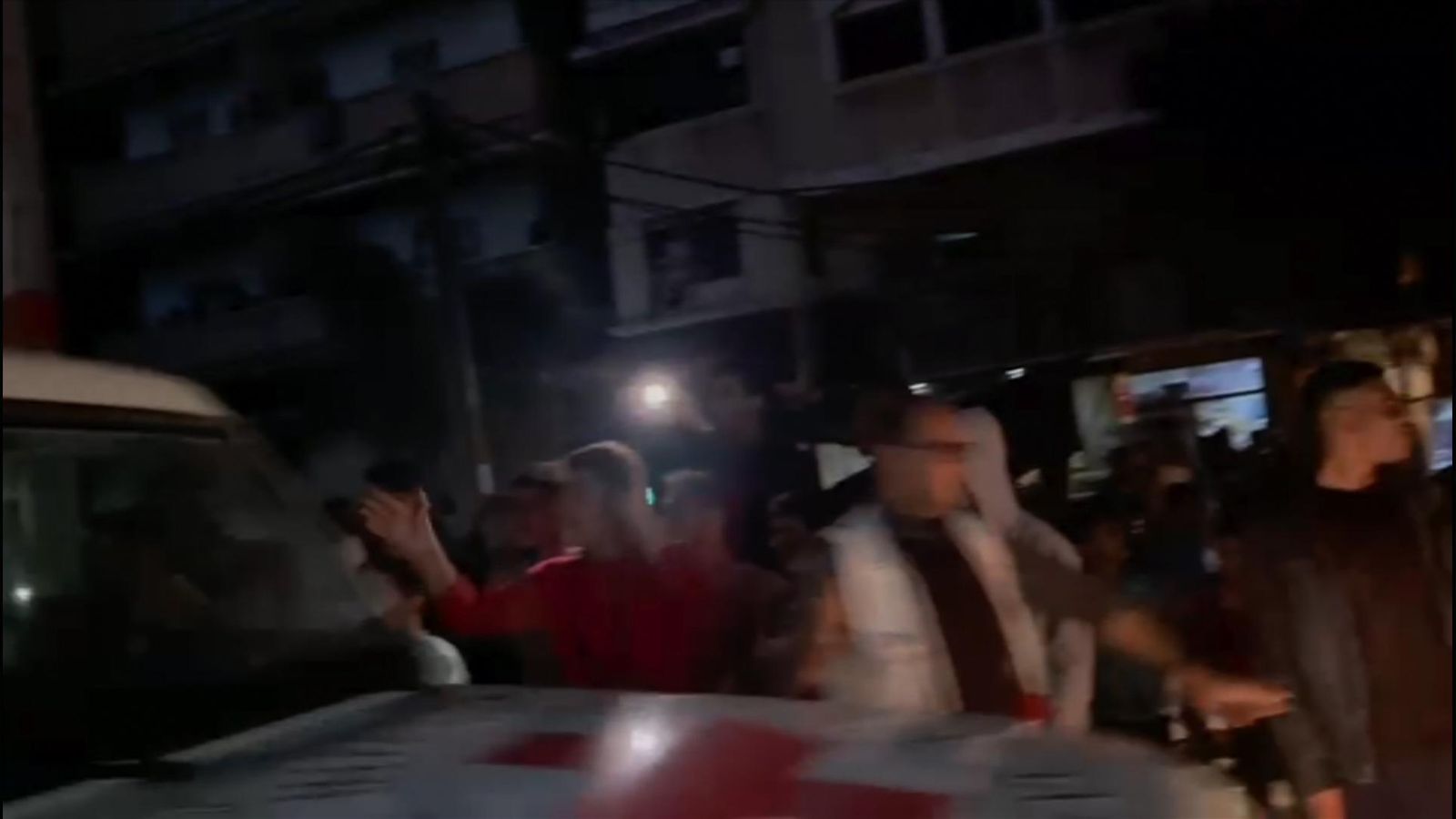 Israel-Hamas war: Crowd cheers as hostages transported from Gaza in Red ...