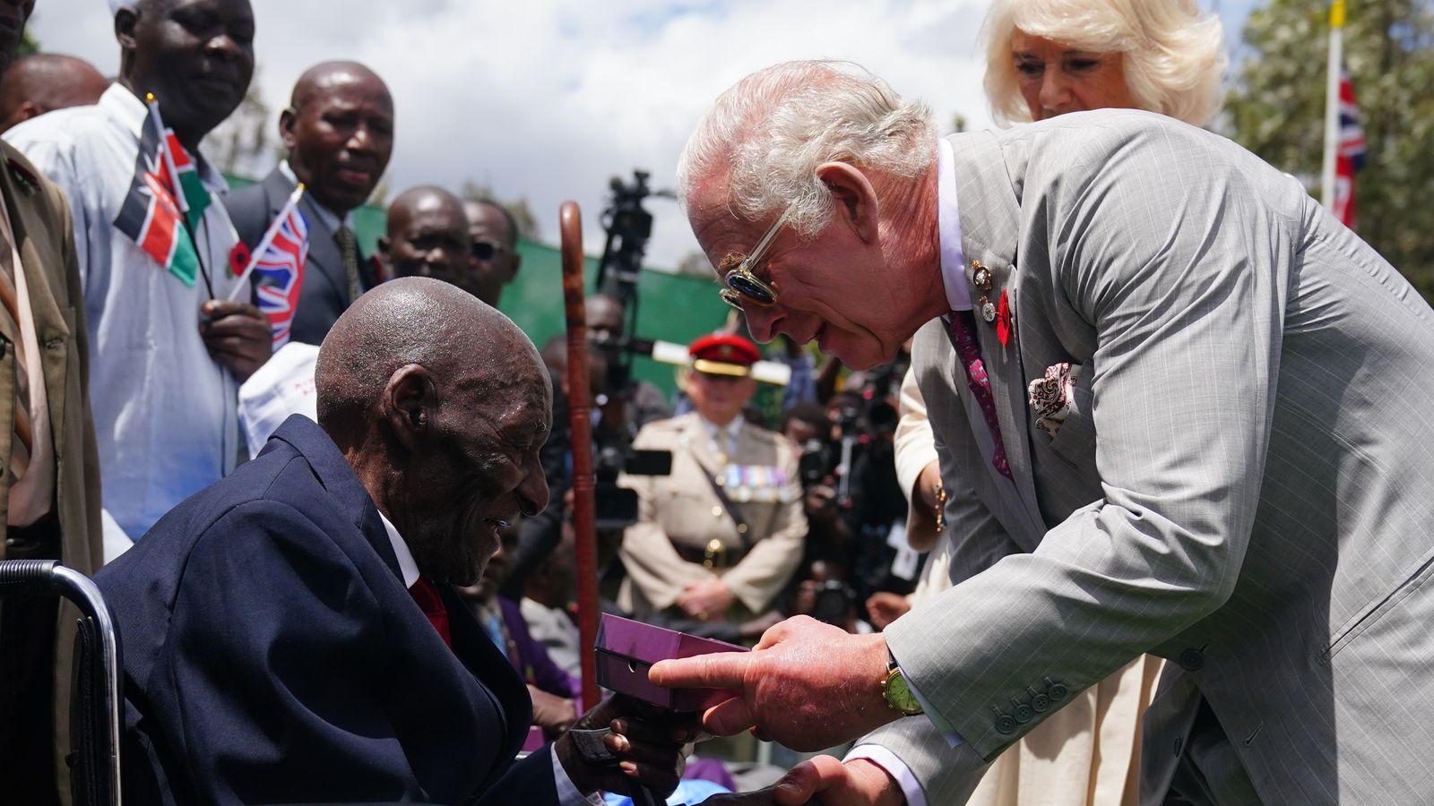 King hands medals to Kenyan veteran thought to be 117 years old - as ...