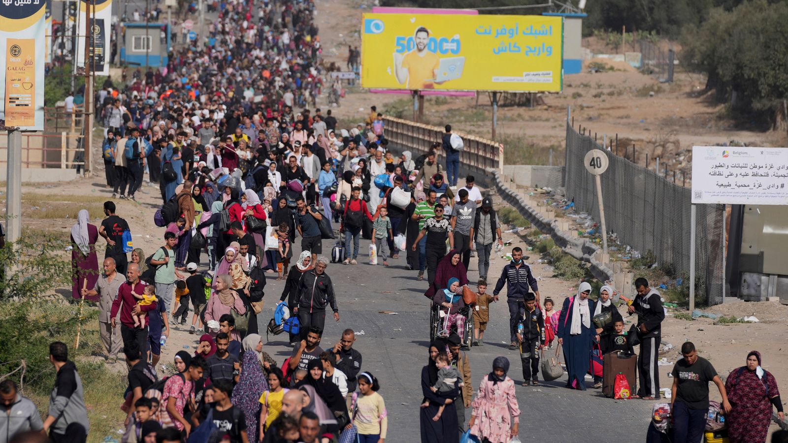 Palestinians stream onto Gaza highway as Israeli forces strike near ...