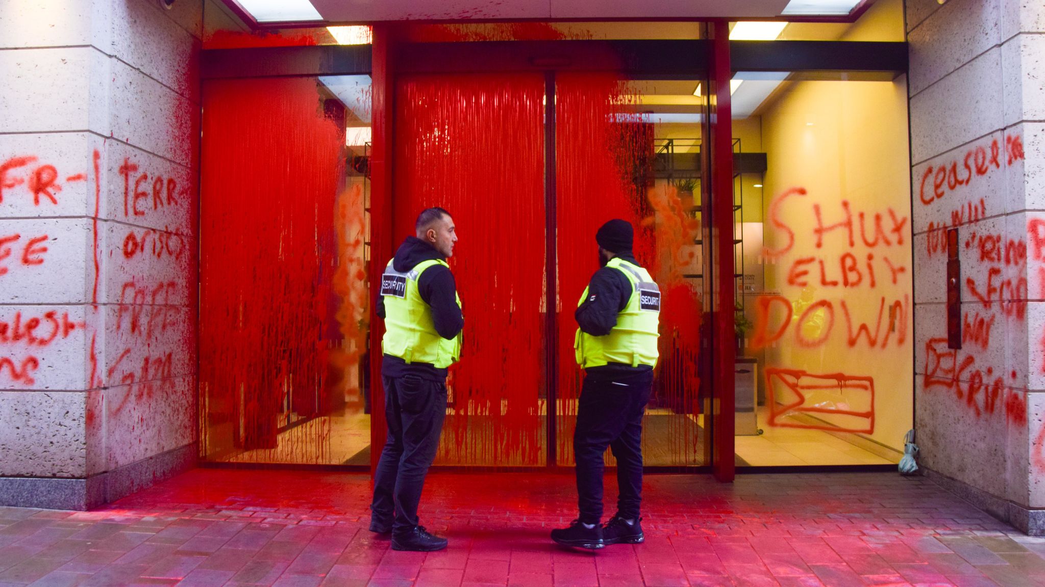 Activists hurl red paint over London building in 'Free Gaza' protest ...