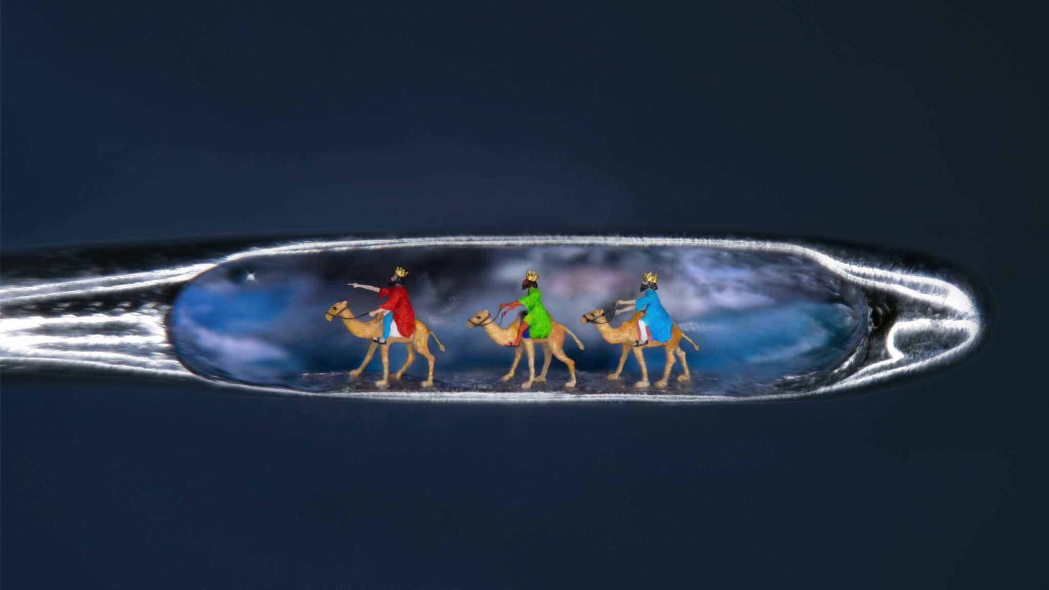 Sculptor produces tiny three wise men in the eye of a needle for ...