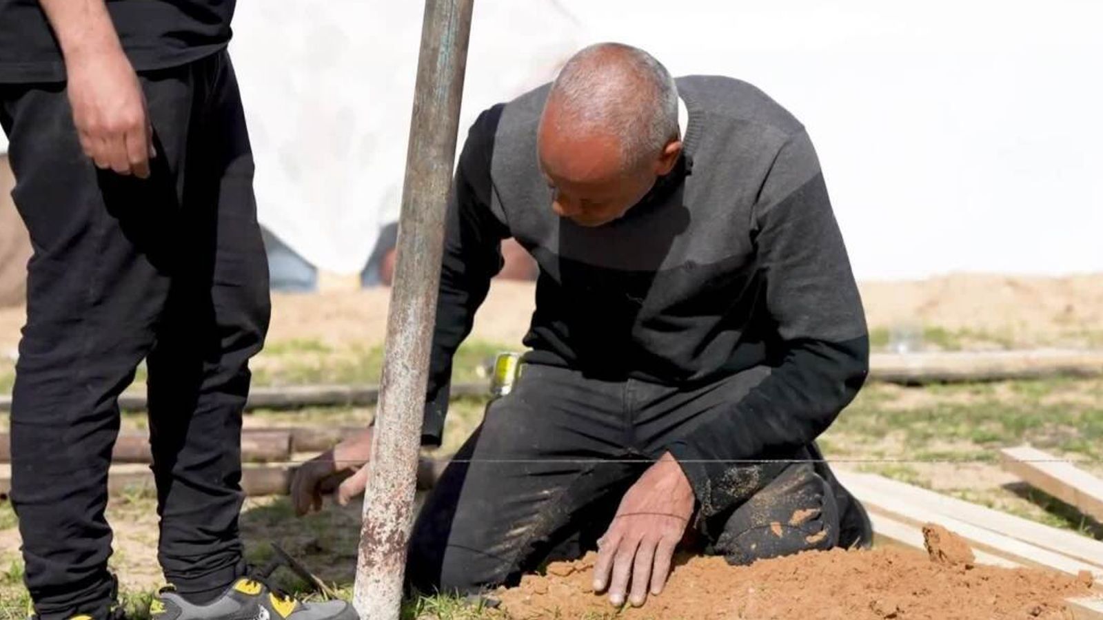 Khalid Abo Middain used his hands, a hammer and a small shovel to build his own shelter in Gaza ...