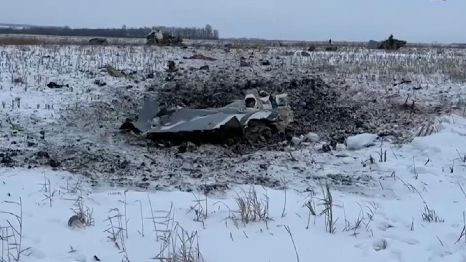 Russian military plane debris scattered across field following crash on ...