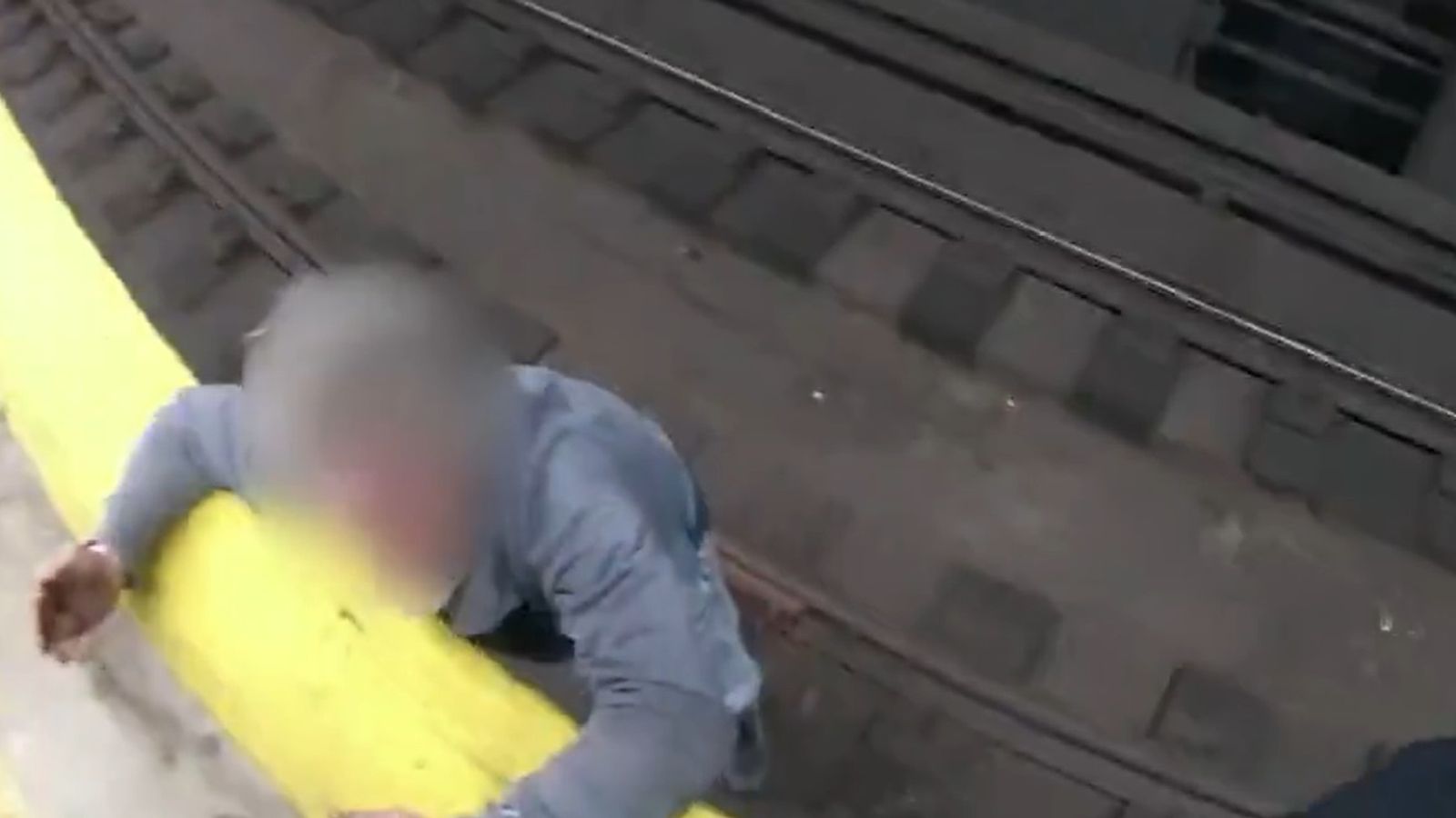 NYPD officer jumps on to subway tracks to rescue man | US News | Sky News